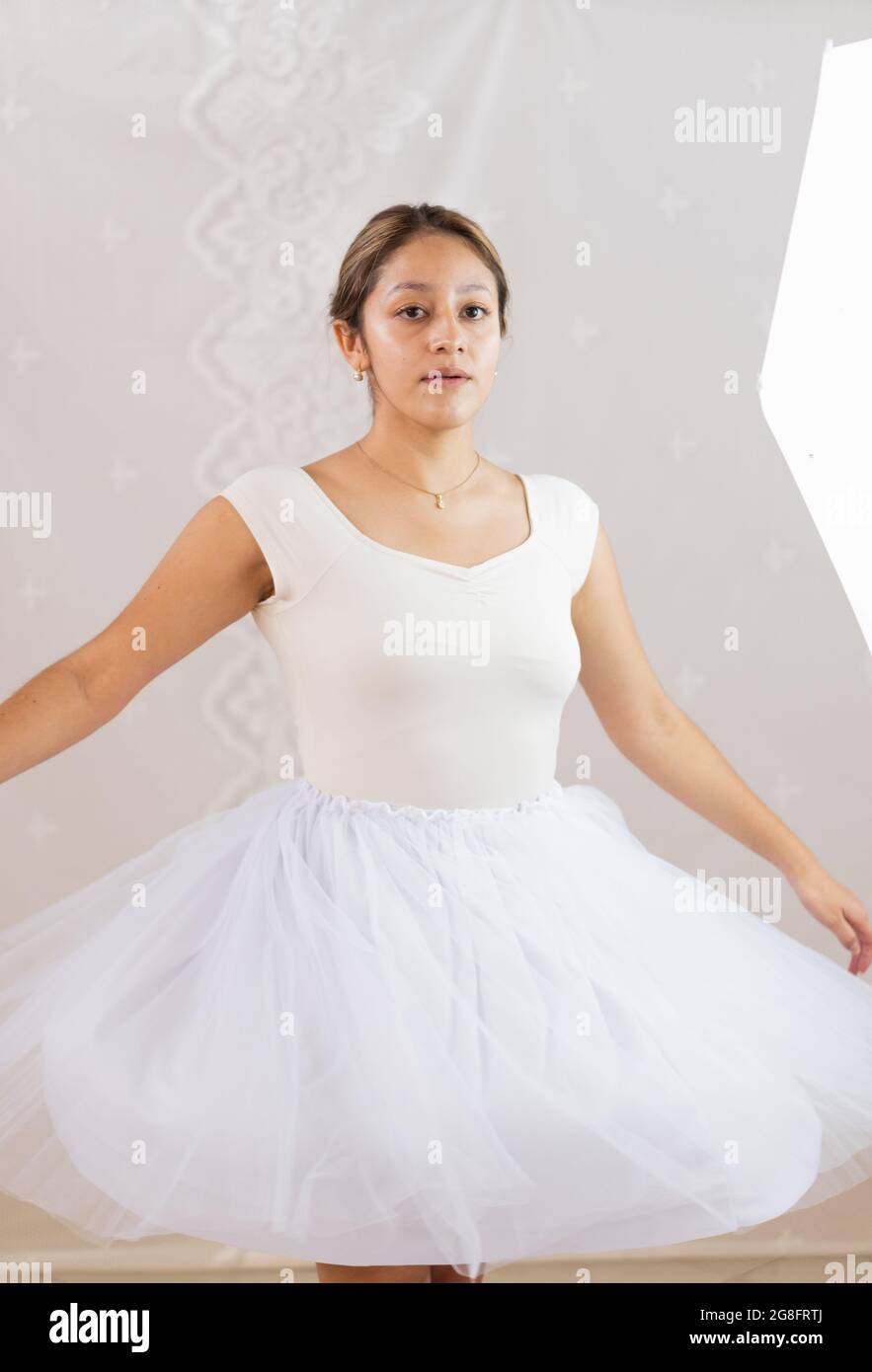 Young female in ballet clothing posing for the camera, taking different ballet steps Stock Photo ...