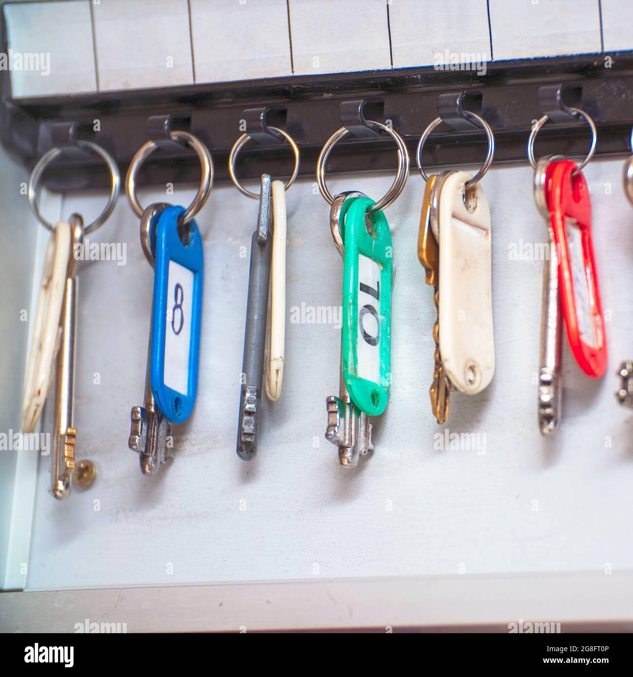 Old keys on key rack hi-res stock photography and images - Alamy
