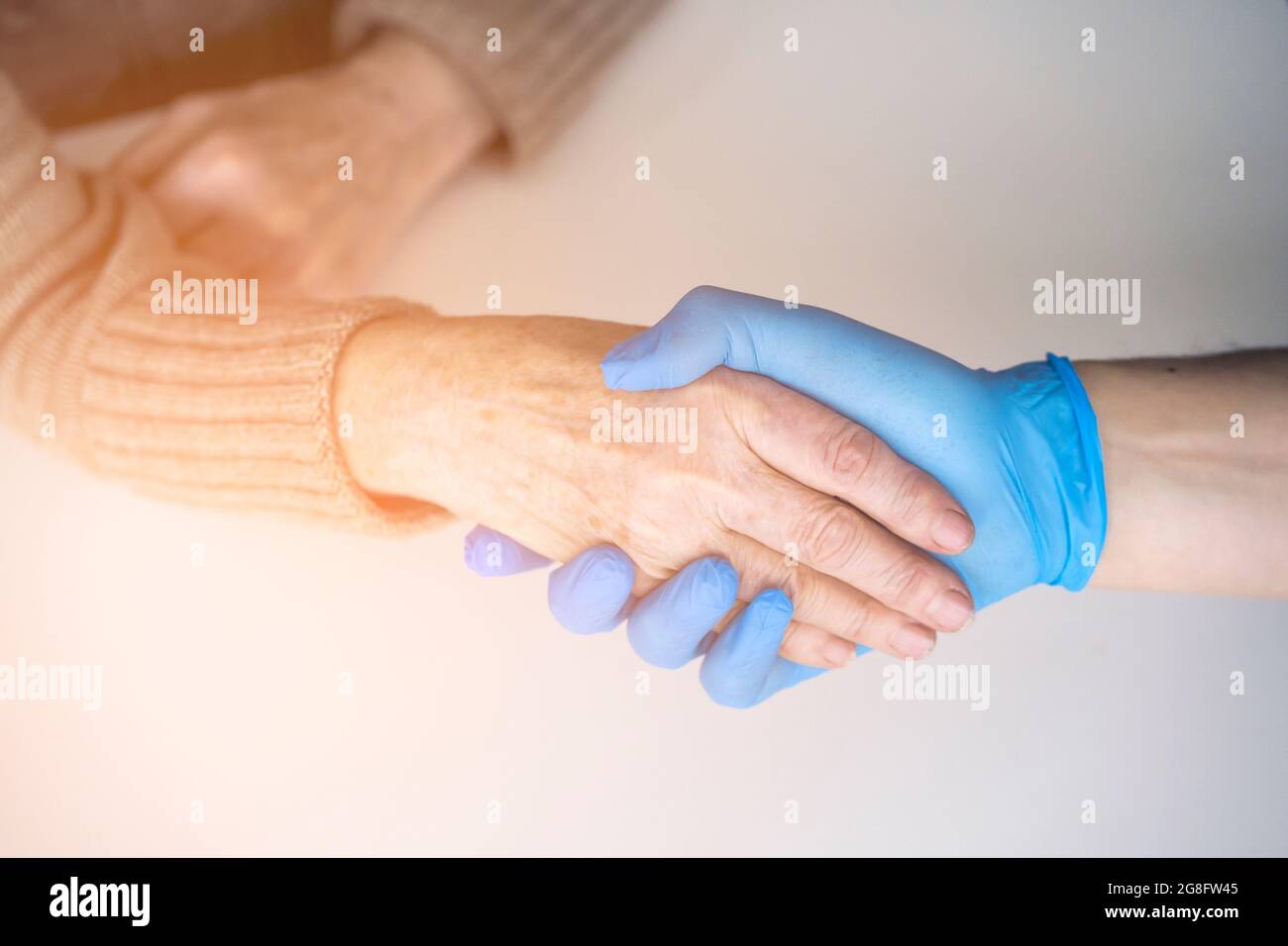 Handshake, caring, trust, treatment and support Stock Photo - Alamy