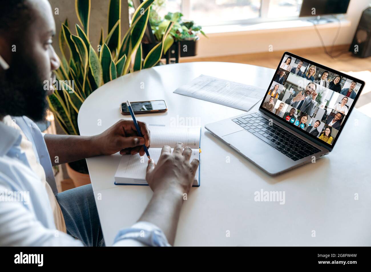 E-learning concept, online education. Focused african american guy ...