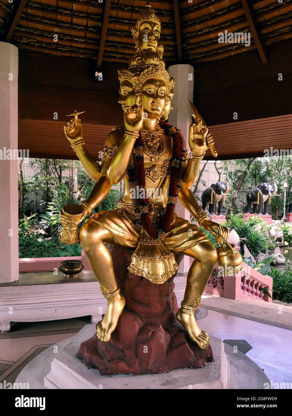 Vertical shot of Manjushri golden figure in a temple Stock Photo - Alamy