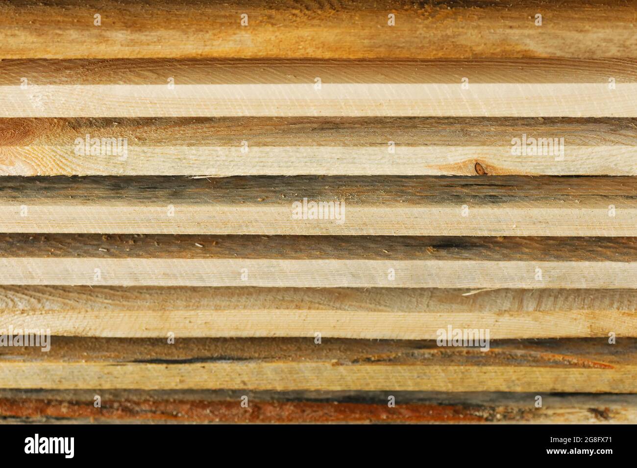 Boards and construction lumber lie in the carpentry workshop ...