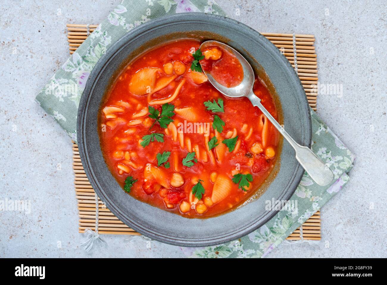 Tomato, chickpeas and pasta soup - overhead view Stock Photo - Alamy