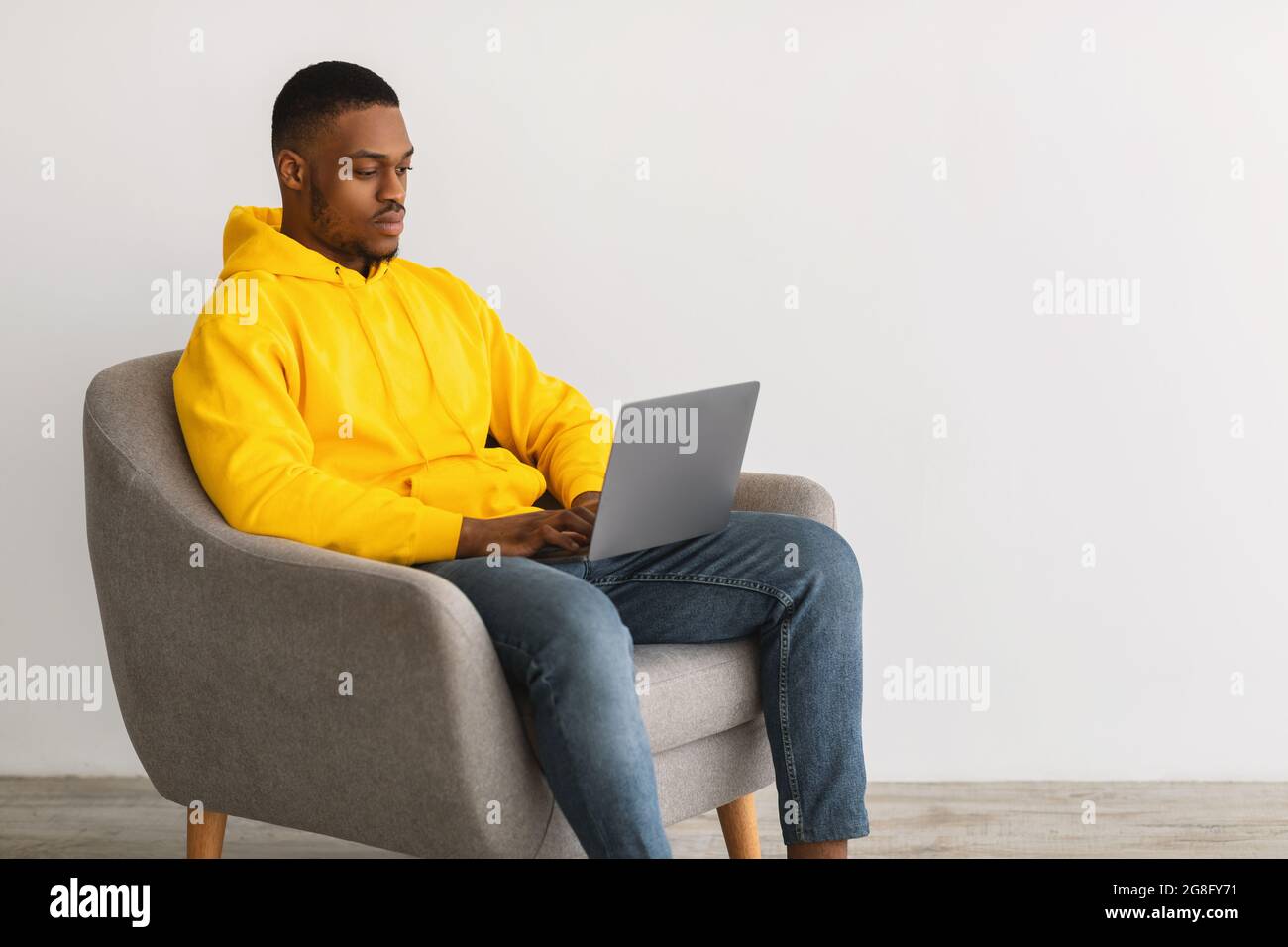 African Freelancer Guy Using Laptop Working Online, Gray Background ...