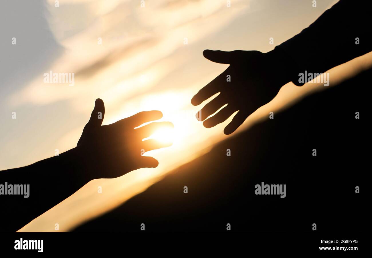 Friendly handshake, friends greeting, teamwork, friendship. The outstretched hands, salvation ...