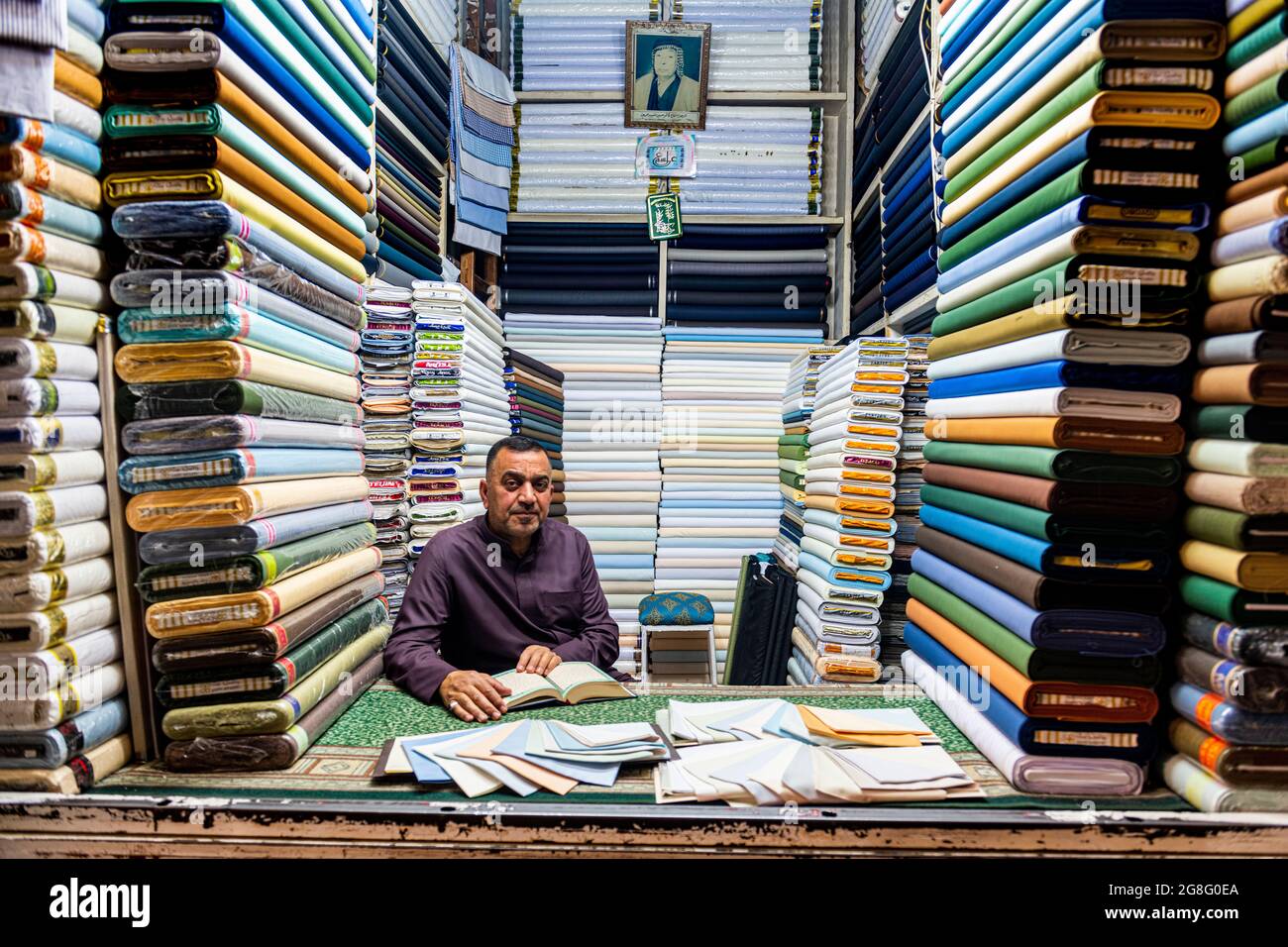 Man in his cloth shop in the Imam Ali Holy Shrine, Najaf, Iraq, Middle ...
