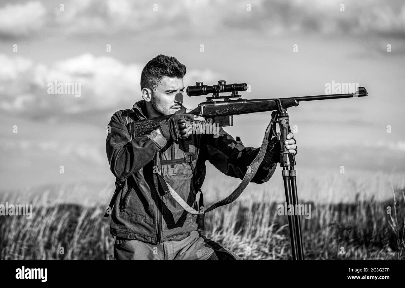 Hunter man. Shooter sighting in the target. Hunting period. Male with a ...