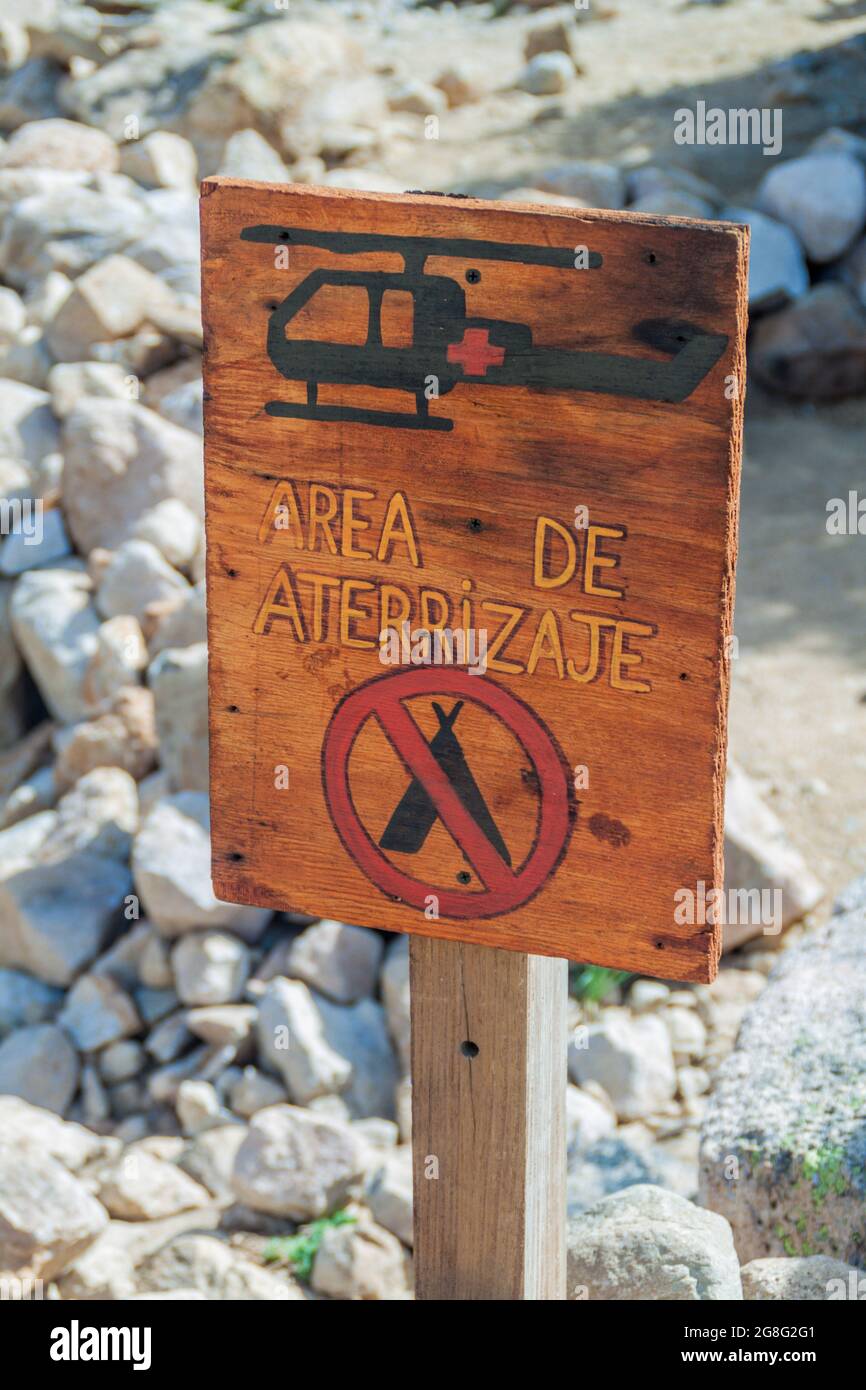 Sign marking helicopter landing spot near mountain hut Refugio Frey ...