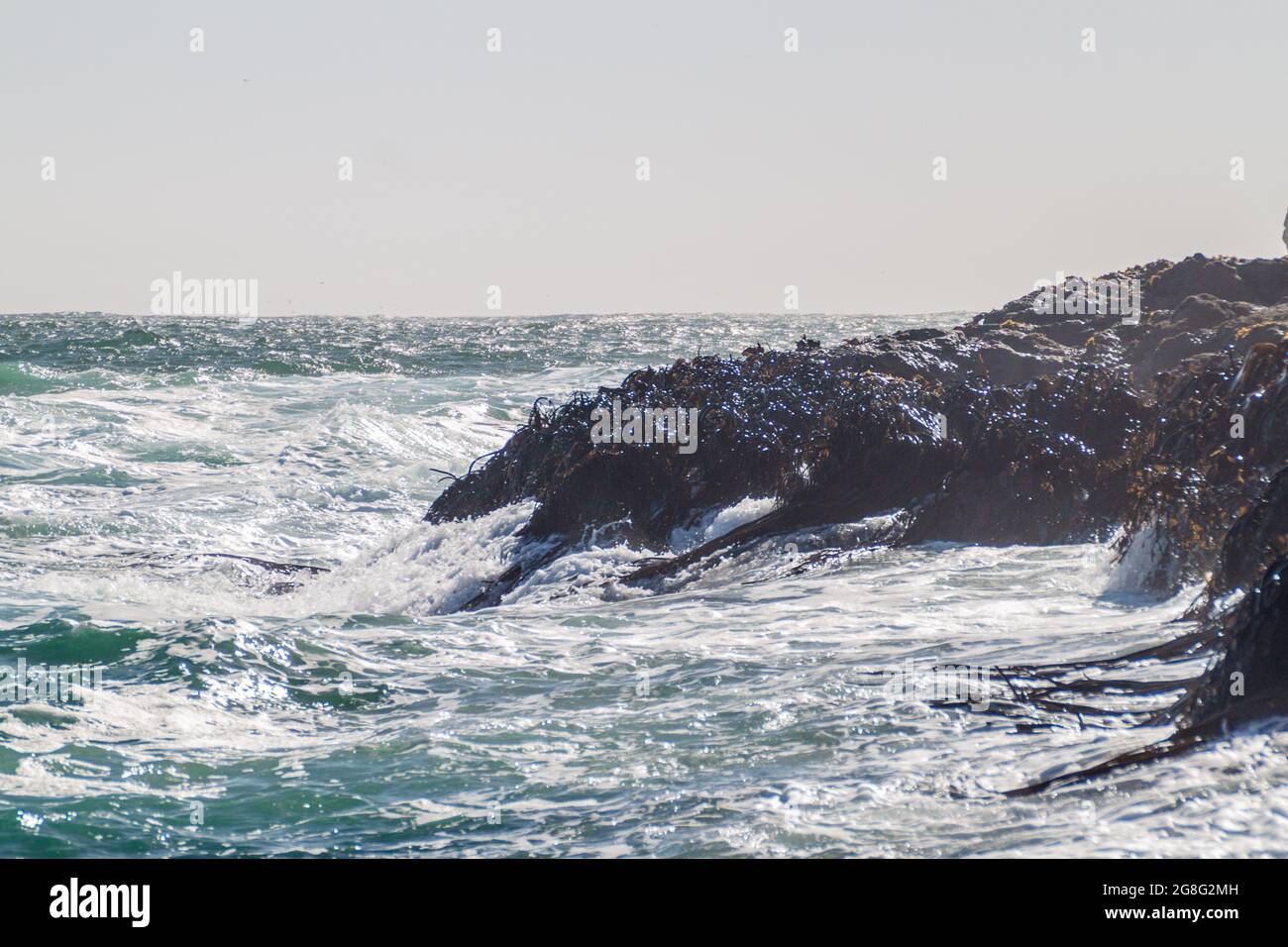 Big waves splash on islets in protected area Monumento Nacional Islotes ...
