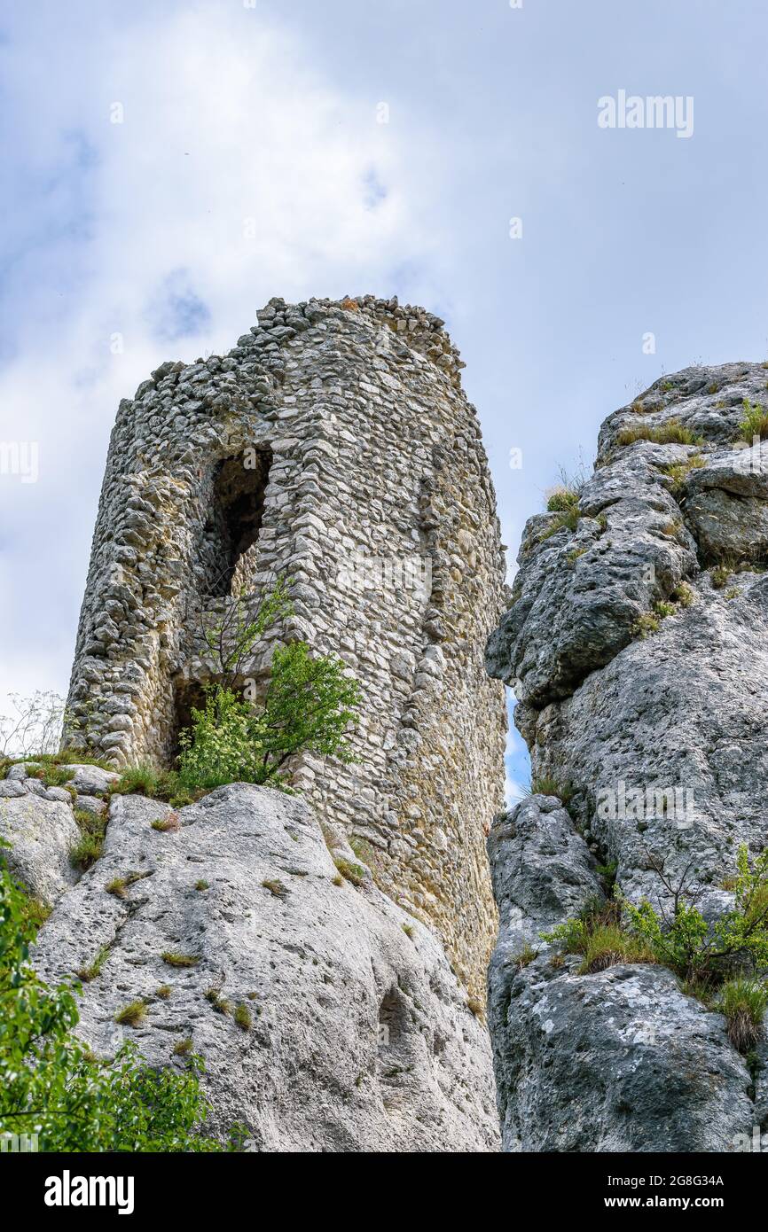 Vertical low angle shot of a natural rock tower on top of a mountain ...