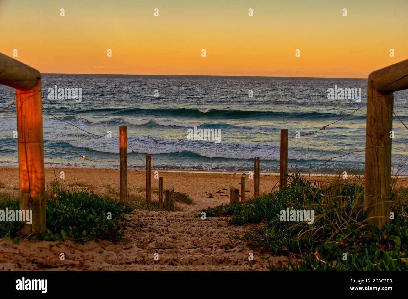 Sand-covered pathway leading towards the beach and the ocean Stock ...