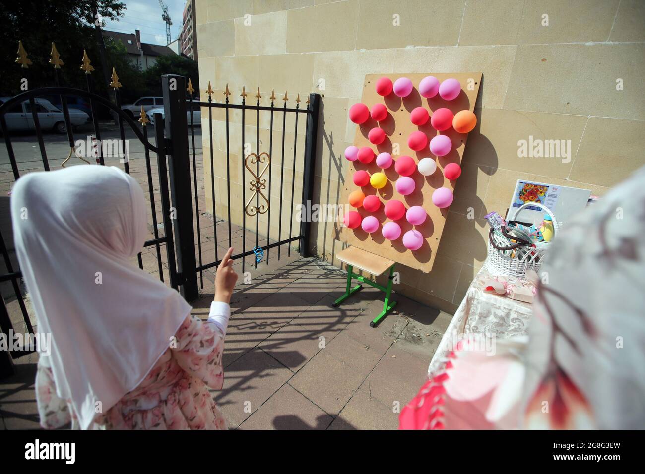 KYIV, UKRAINE - JULY 20, 2021 - A girl in a hijab tries her hand in ...