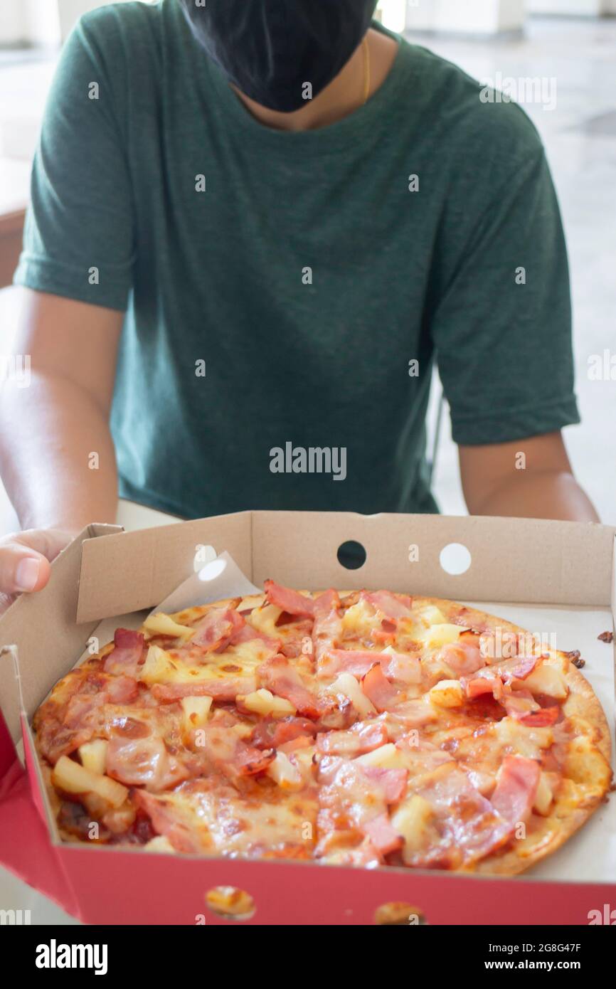 Office eating pizza slice desk hi-res stock photography and images - Alamy