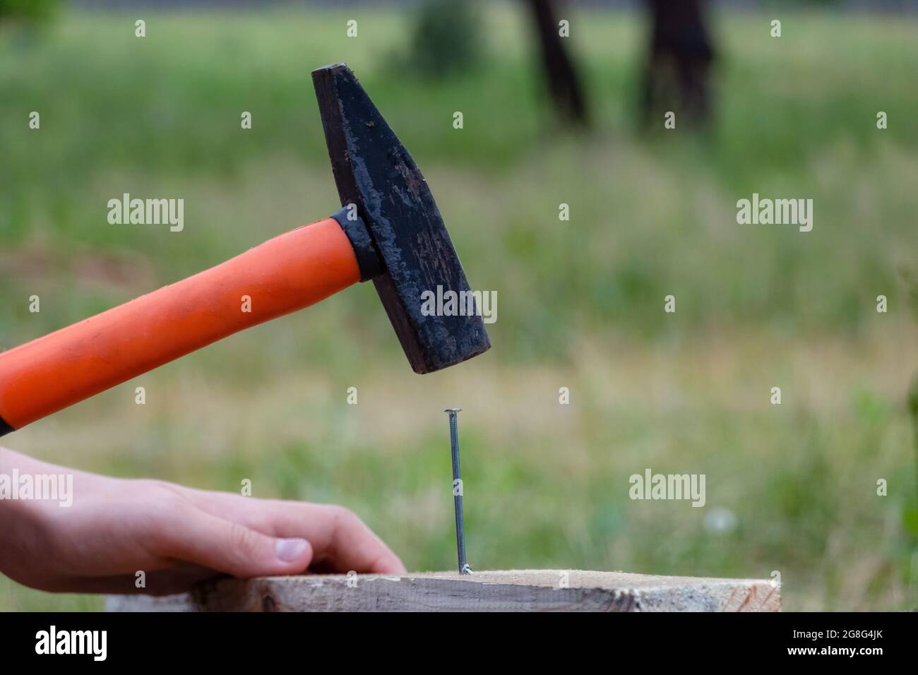 Hammer hitting nail hi-res stock photography and images - Alamy