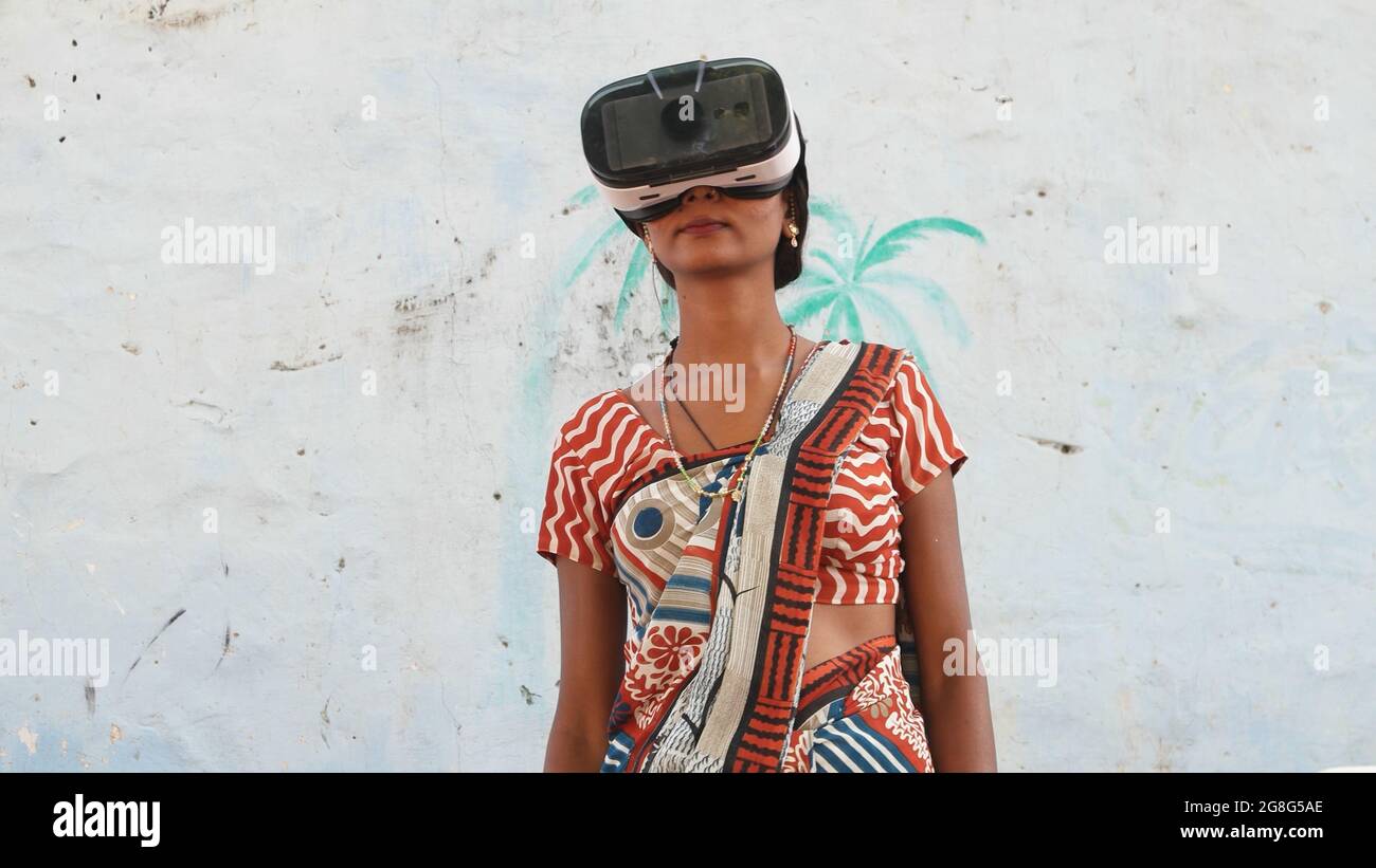 Beautiful Indian woman dressed in traditional clothing while wearing a ...