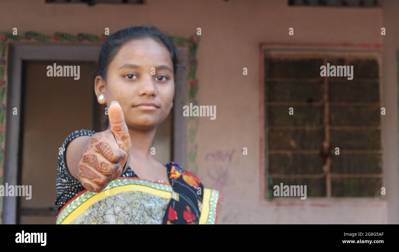 Low angle shot of a young South Indian girl in traditional clothing ...
