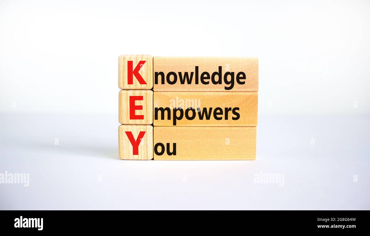 KEY, knowledge empowers you symbol. Wooden blocks with words 'KEY ...