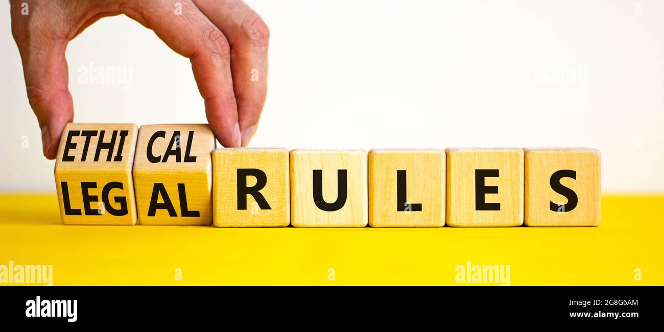 Ethical or legal rules symbol. Businessman turns wooden cubes and ...