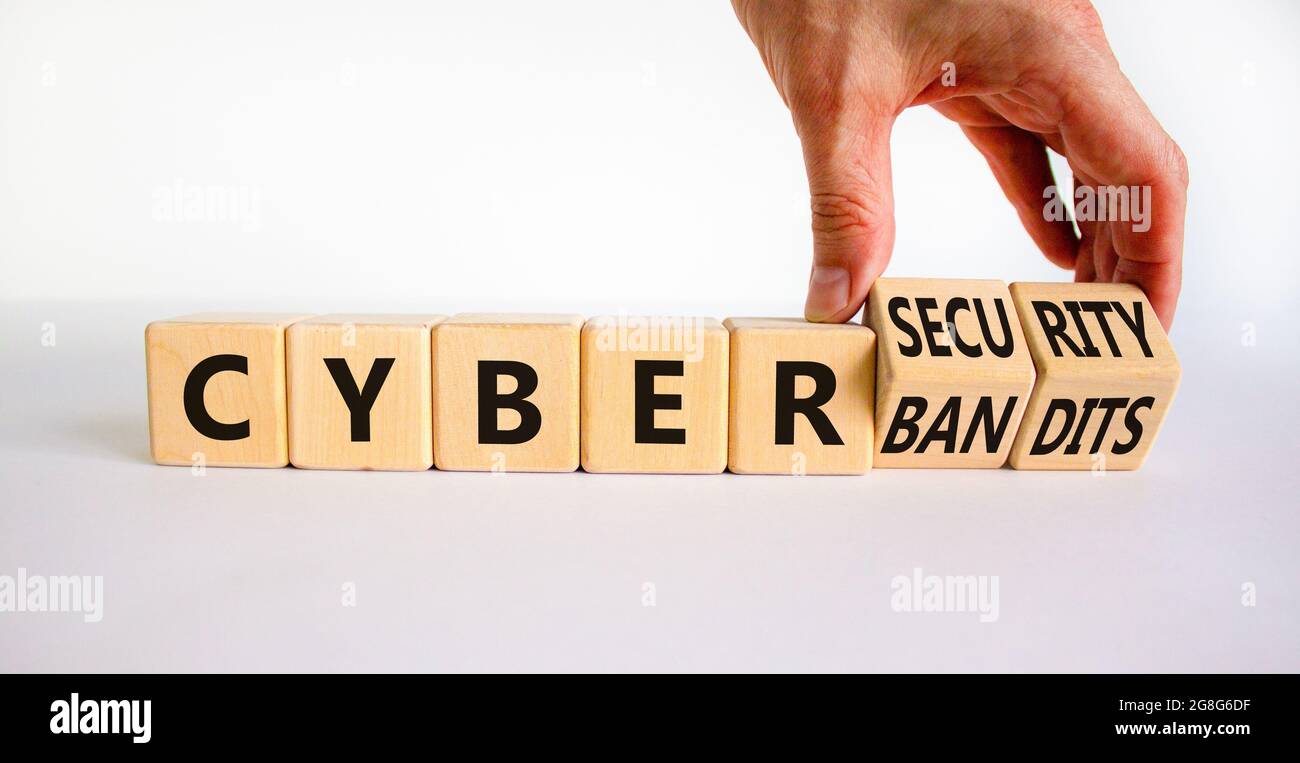 Cyber-security vs cyber-bandits symbol. Businessman turns wooden cubes ...