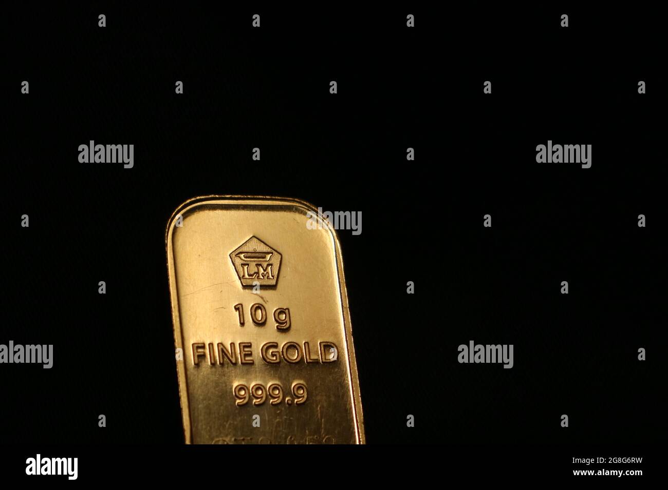 Fine gold bar (goldbar) on black background, produced by PT Aneka ...