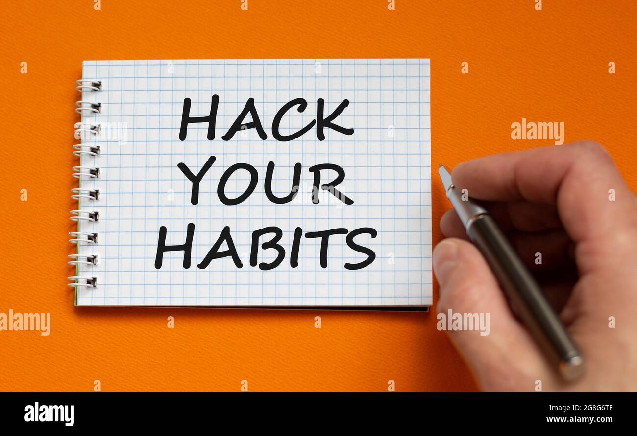 Hack your habits symbol. Businessman writing words 'Hack your habits ...