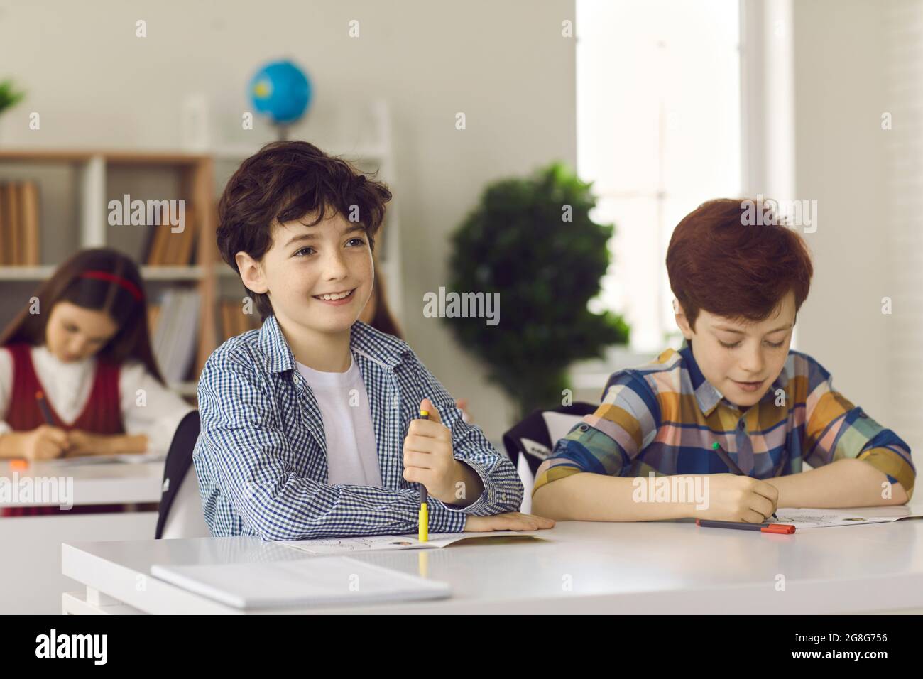 Children at school desk hi-res stock photography and images - Alamy