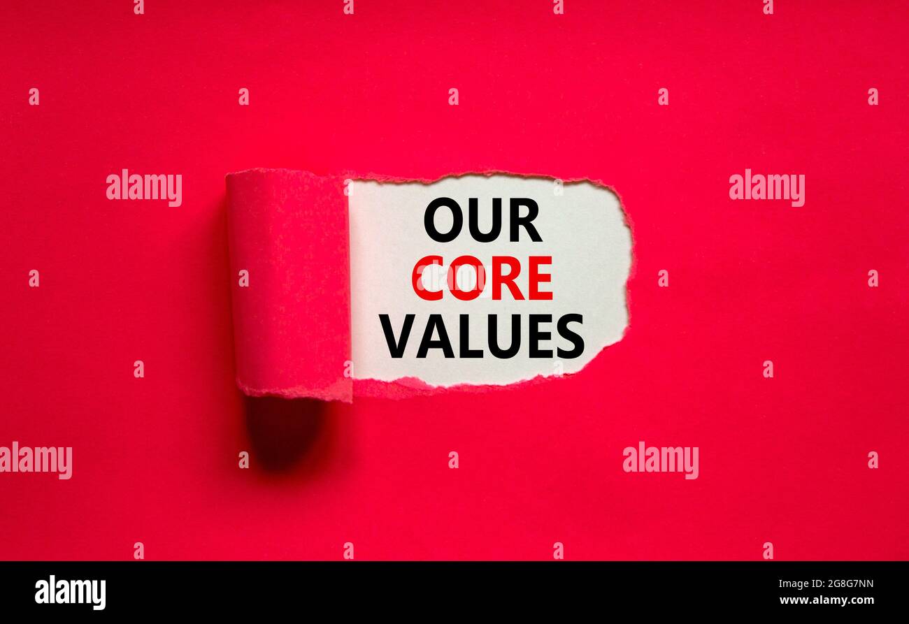 Our core values symbol. Words 'Our core values' appearing behind torn ...