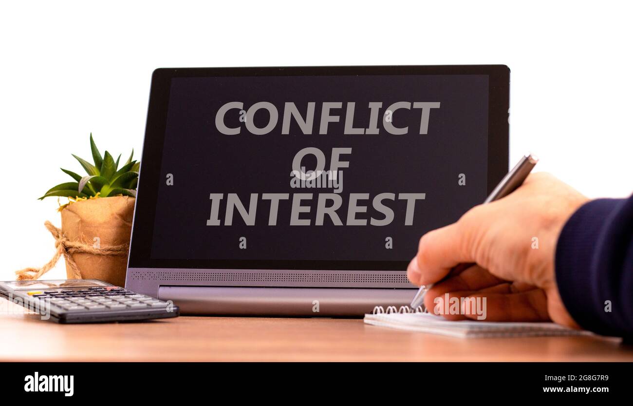 Conflict of interest symbol. Tablet with words 'Conflict of interest ...