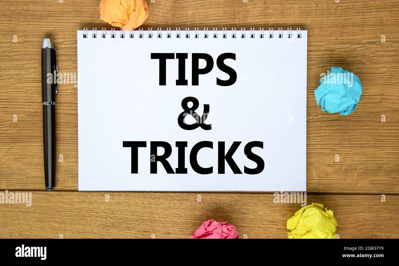Tips and tricks symbol. Words 'Tips and tricks' on white note on ...