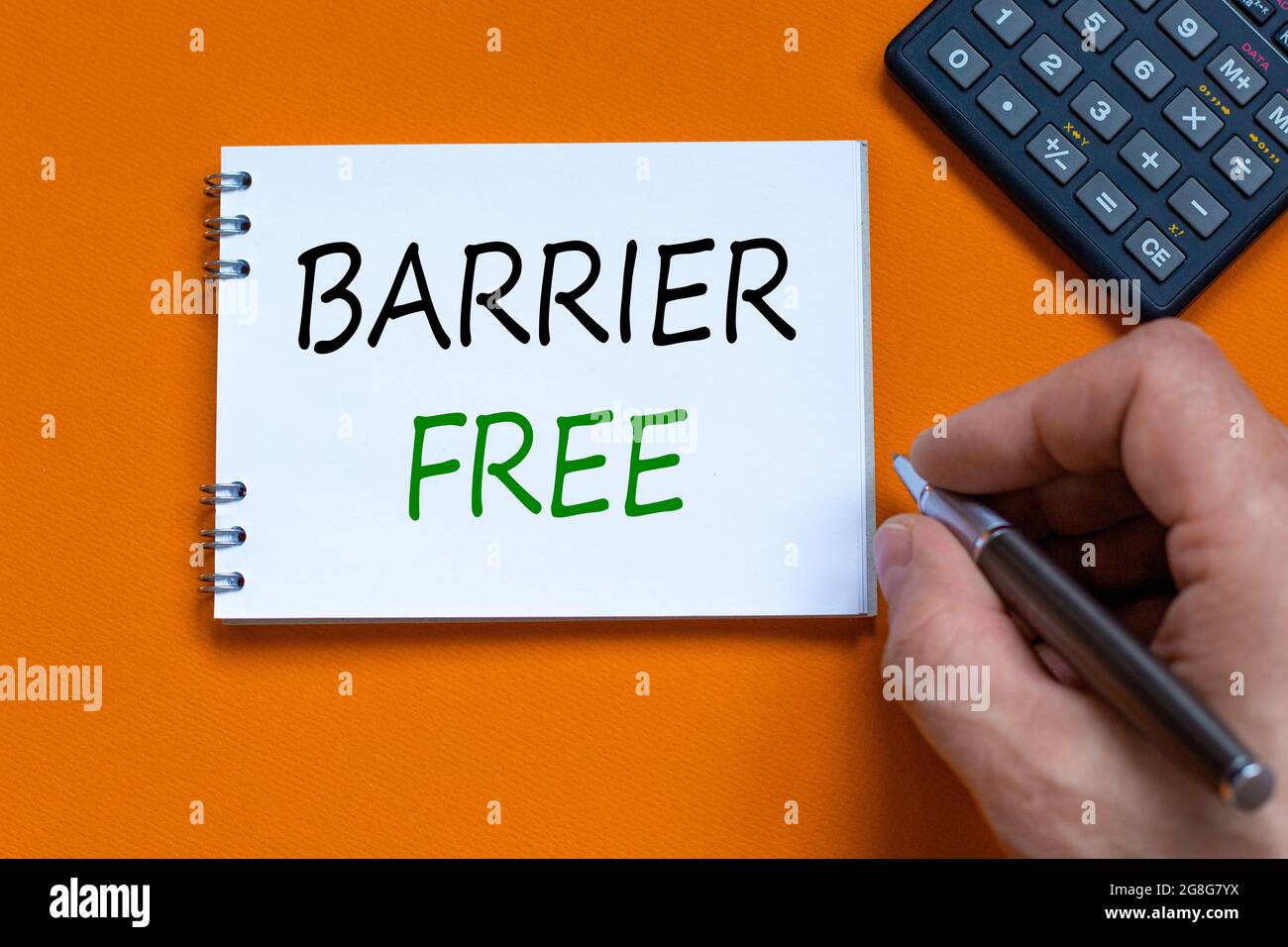 Barrier free symbol. Businessman writing words 'Barrier free' on white ...