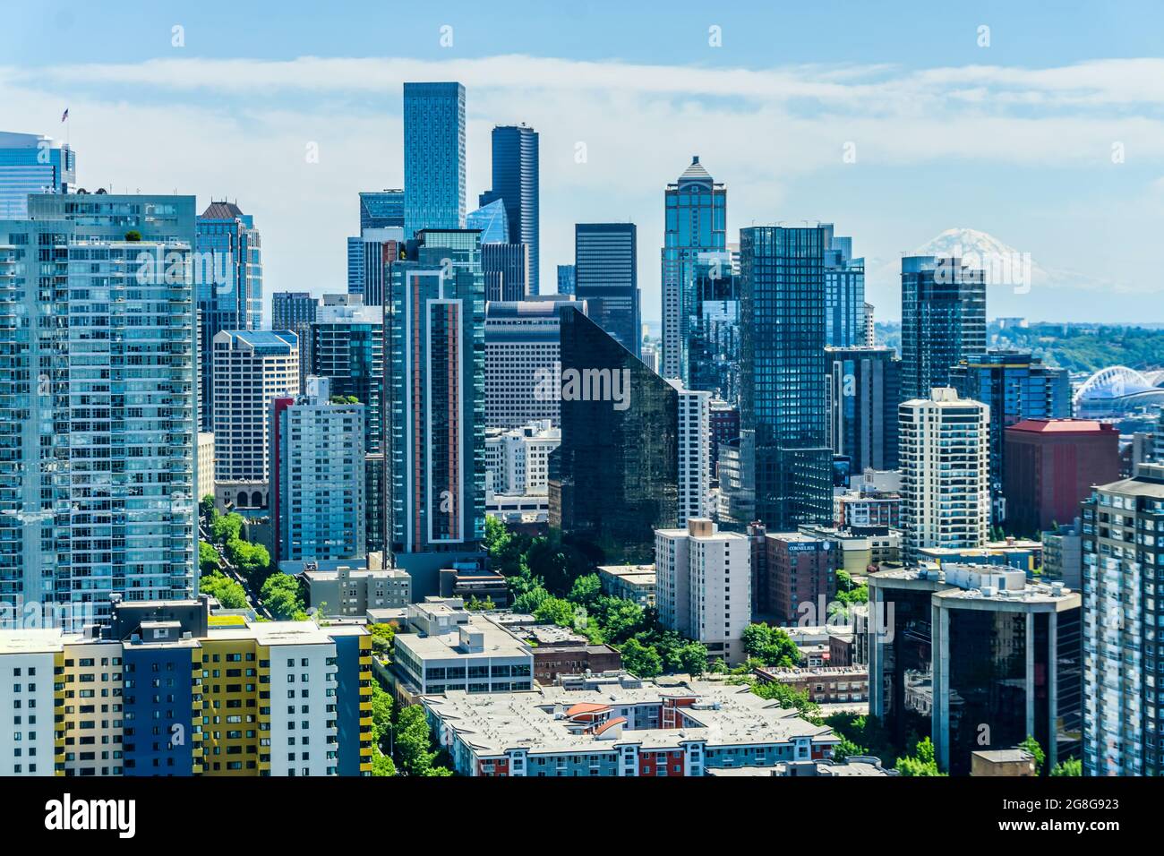 Tall buildings in downtown Seattle, Washington with Mount Rainier in ...
