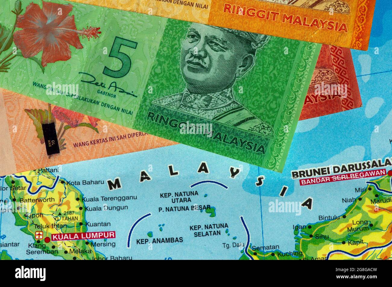 Top view of money, banknote of Ringgit Malaysia and the Malaysia map ...