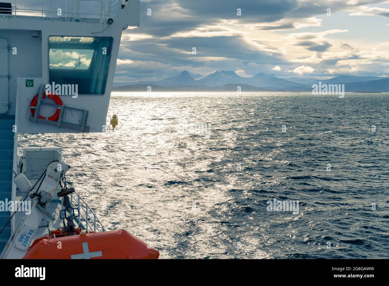 Cabin of a boat sailing in the sea by Lofoten Islands. Dramatic clouds ...