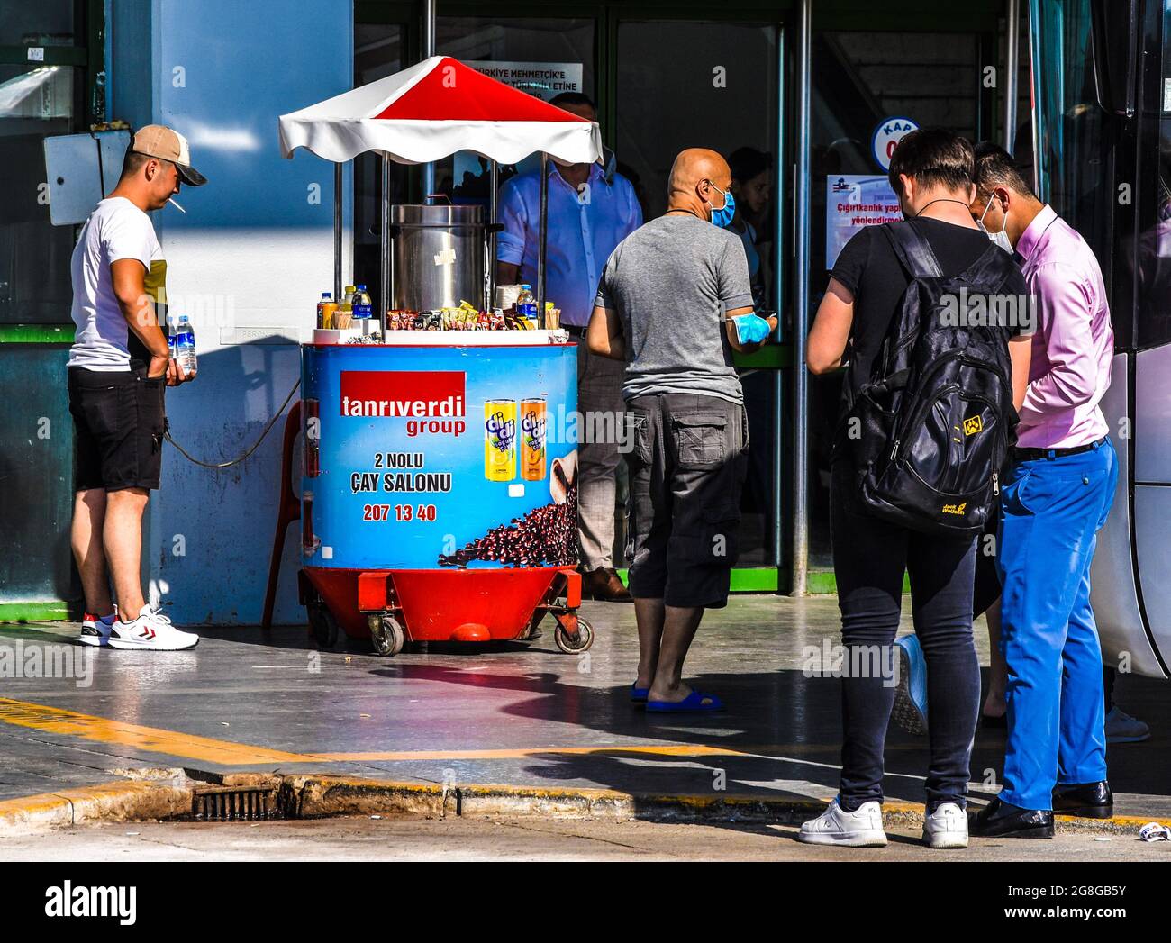 Passengers wait for their buses at the central intercity bus terminal ...