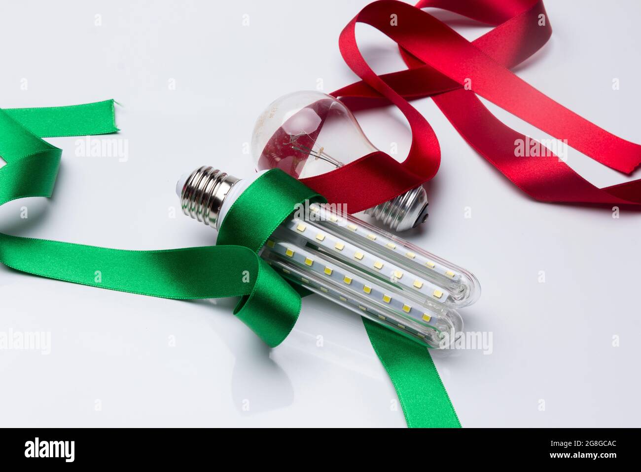 Energy-saving light bulb and classic incandescent bulb with high energy ...