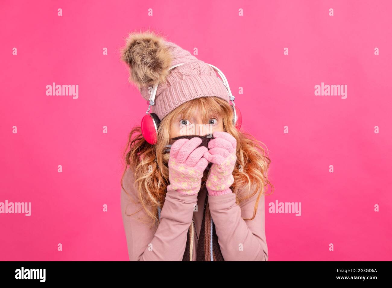 isolated warm woman with headphones and cold expression Stock Photo - Alamy