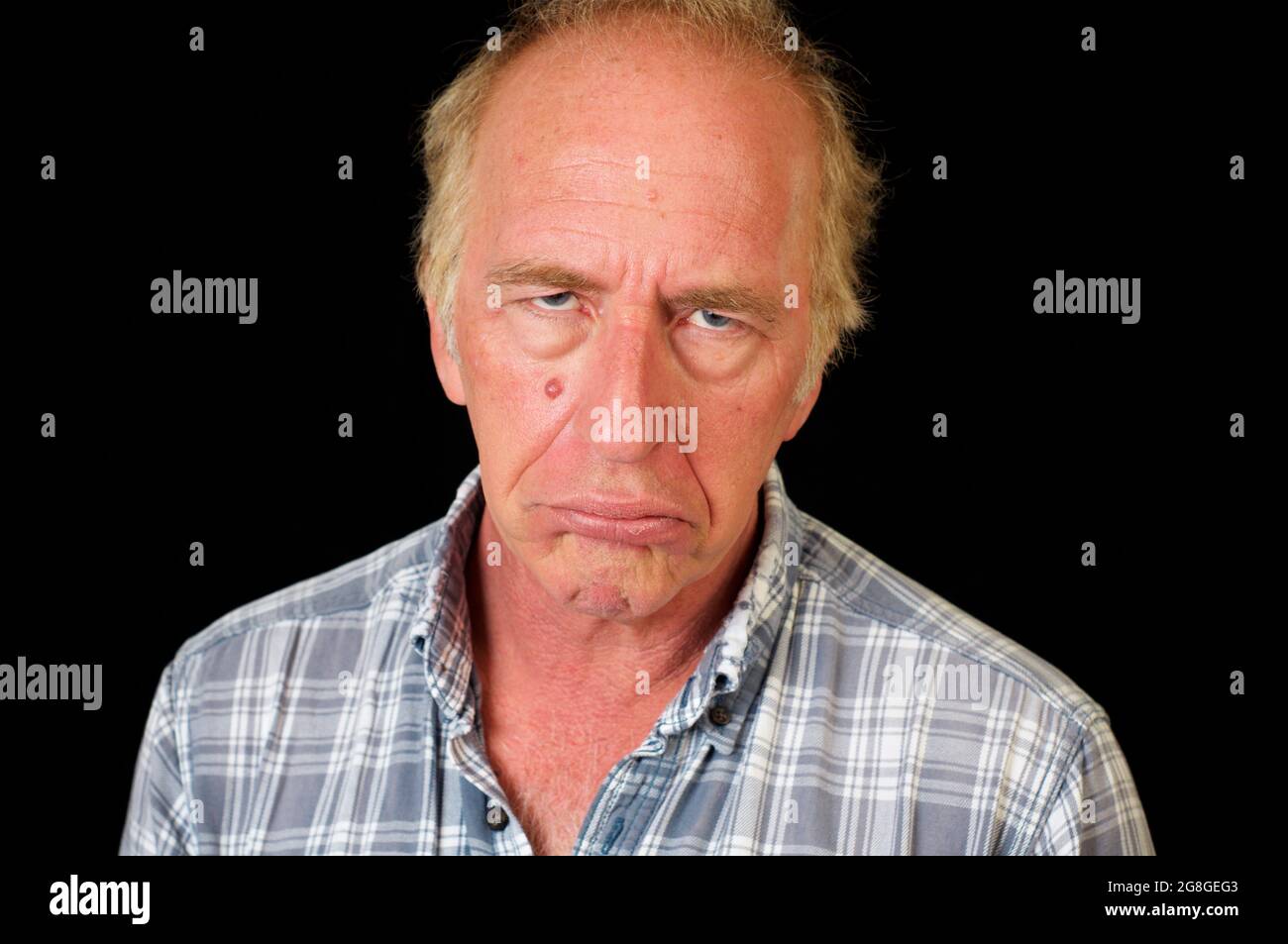 Sad man wearing blue shirt hi-res stock photography and images - Alamy