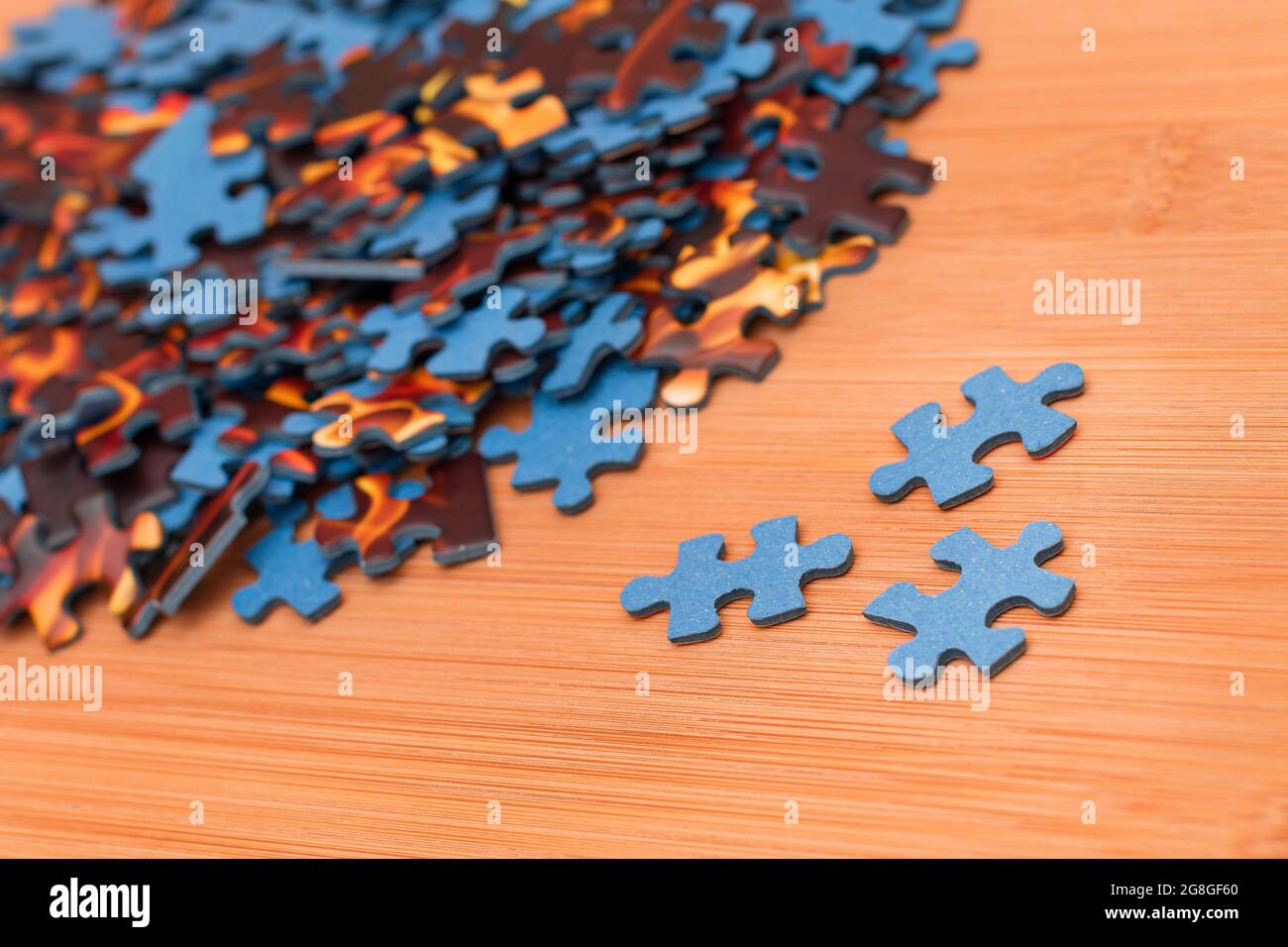 Colorful Peaces of a Mixed Jigsaw Puzzle Lie on the Wooden Table ...