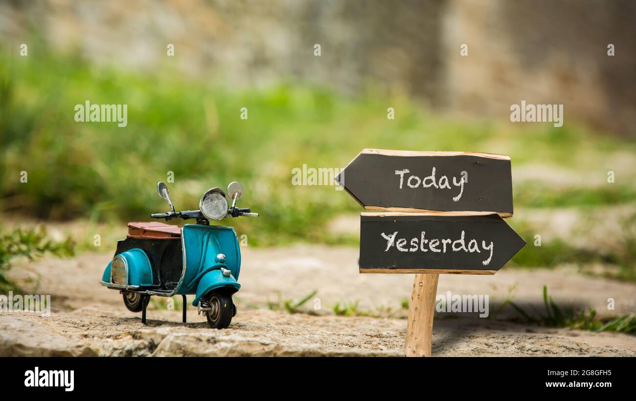 Wall Sign the Direction Way to Today versus Yesterday Stock Photo - Alamy
