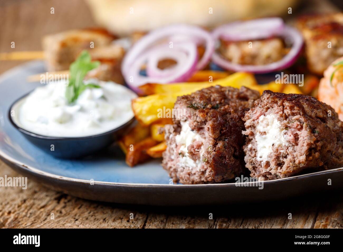 greek bifteki meat with french fries Stock Photo - Alamy