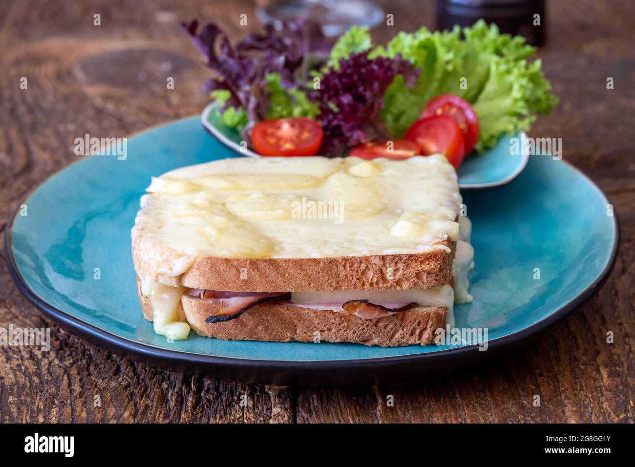 french croque monsieur on a blue plate Stock Photo - Alamy