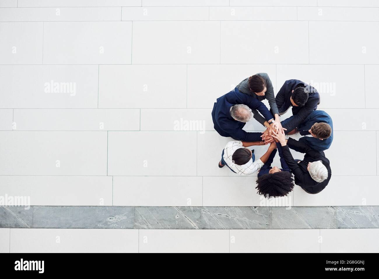 Standing together as one committed and ambitious team Stock Photo - Alamy