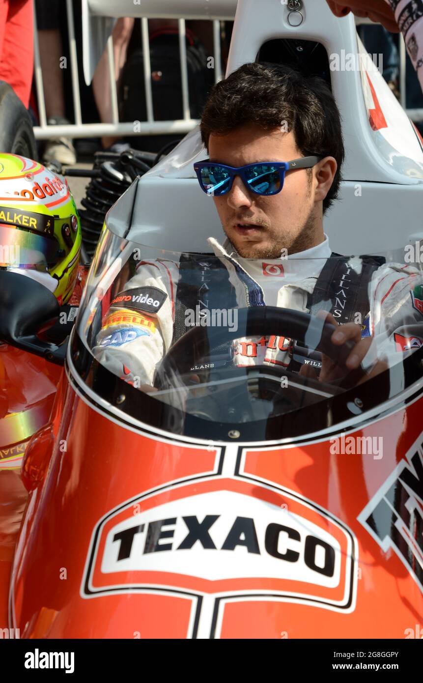 Sergio Perez, racing driver, preparing to race a historic McLaren M23 ...