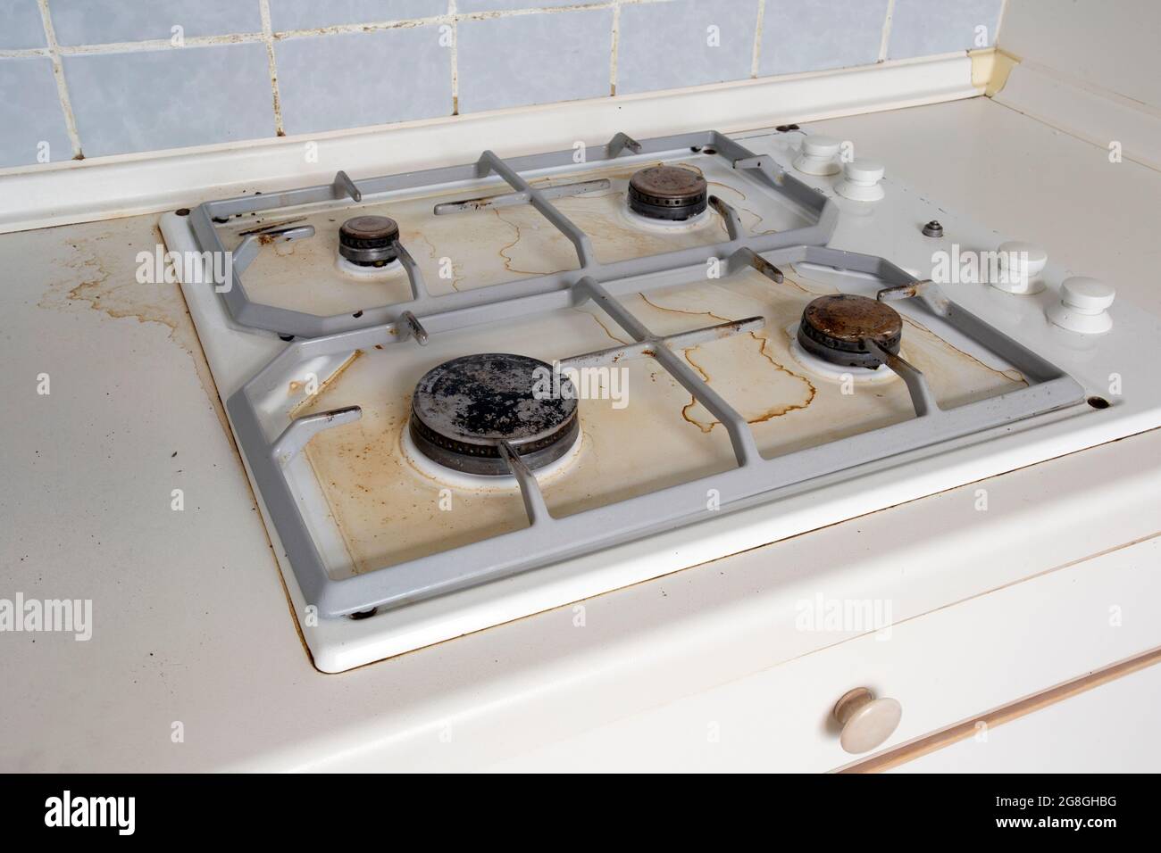 Dirty gas stove cooking oil stains on gas stove in kitchen.An Unclean ...