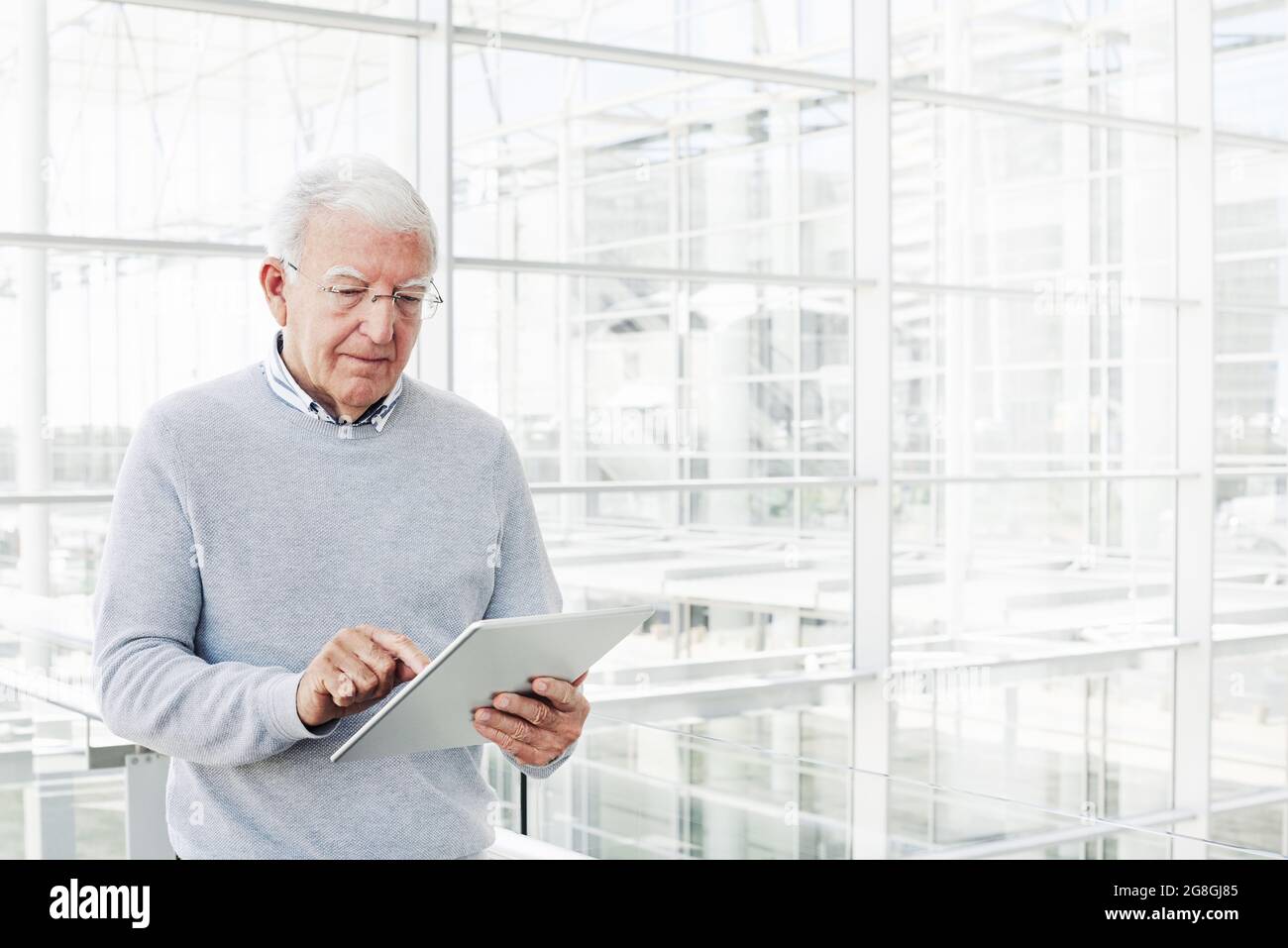 His hard work is always supported by smart technology Stock Photo - Alamy