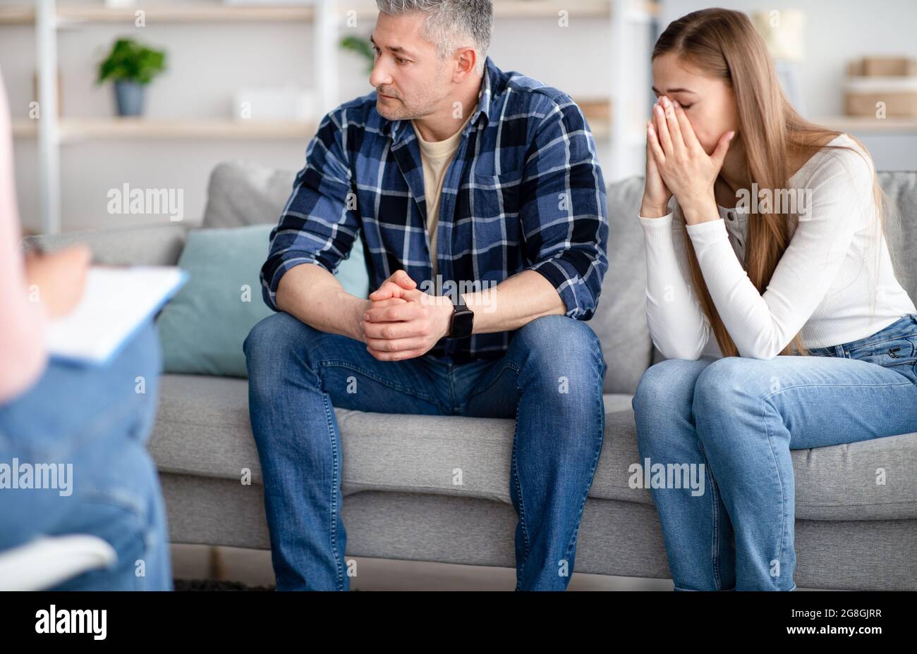 Mature couple seeking professional help, having consultation with ...