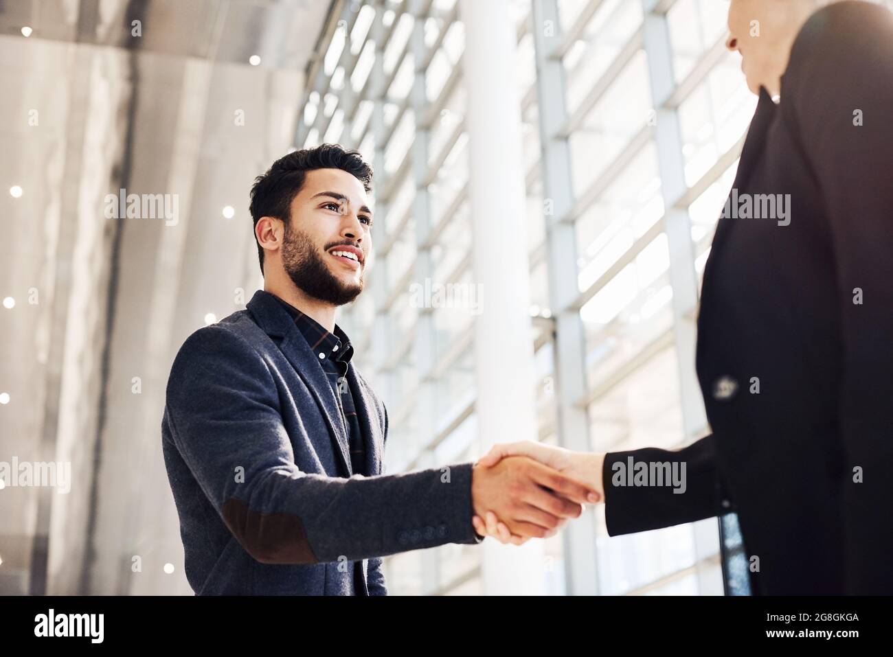 Sealing the deal with a handshake Stock Photo - Alamy