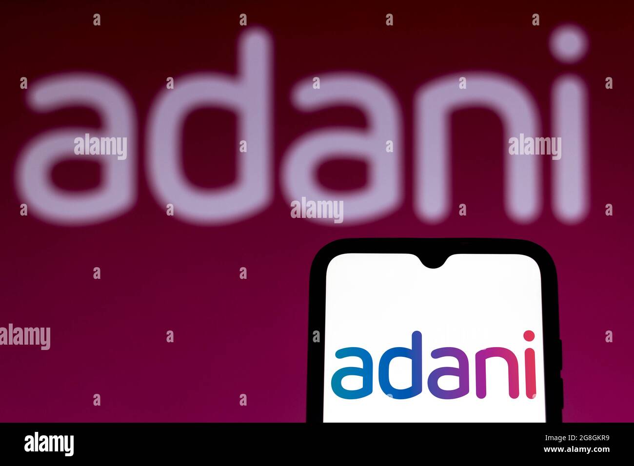 In this photo illustration the Adani Group logo seen on a smartphone ...