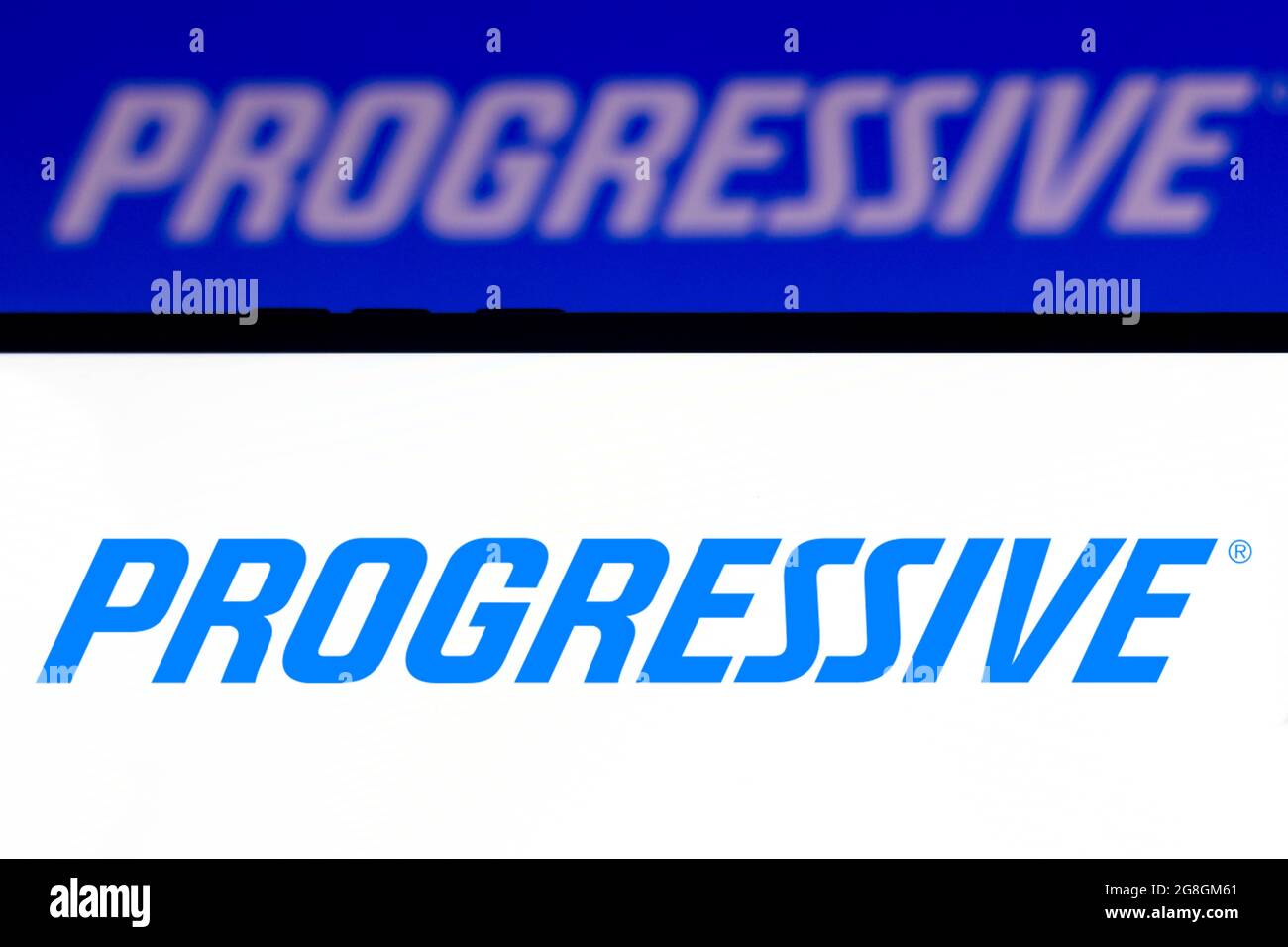 In this photo illustration the Progressive Corporation logo seen on a ...