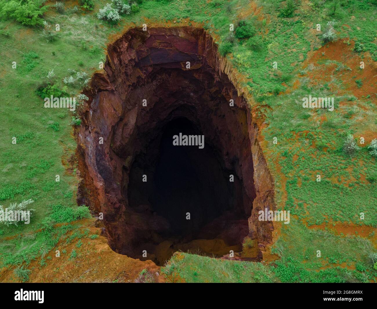 overhead view of collapsed mine big hole in land Stock Photo - Alamy